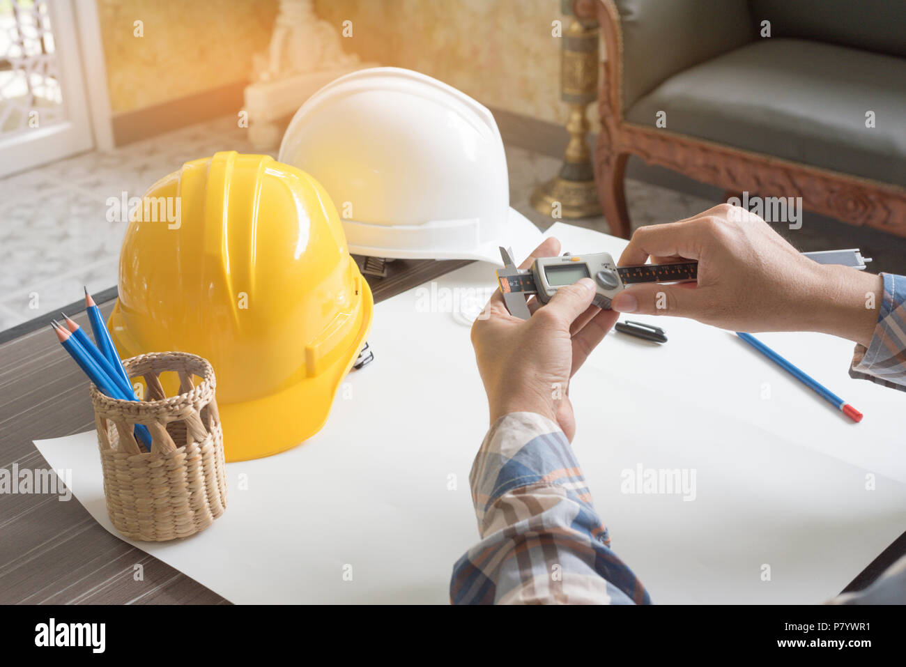 Construction engineer measuring with vernier caliper. Business and ...