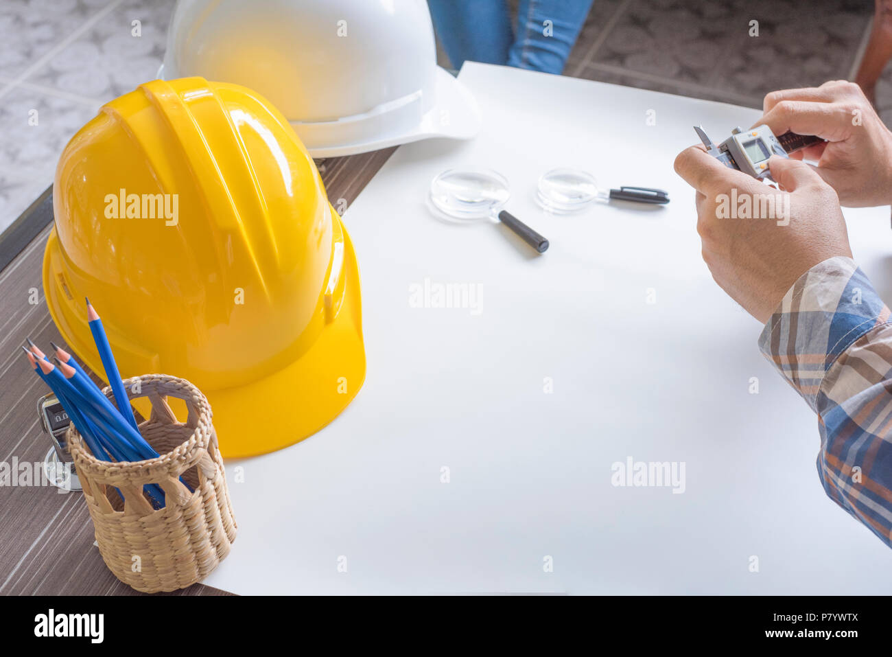 Construction engineer measuring with vernier caliper. Business and ...