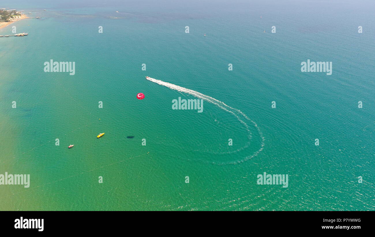 Aerial view of a parasail at Antalya Turkey. People are playing ...