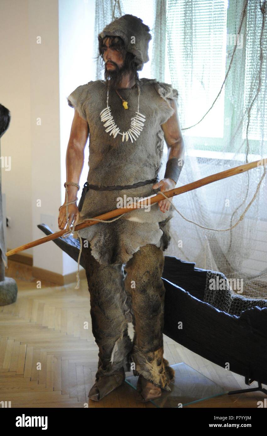 Poland. Prehistory. Neolithic. Recreation of a hunter and his dress ...