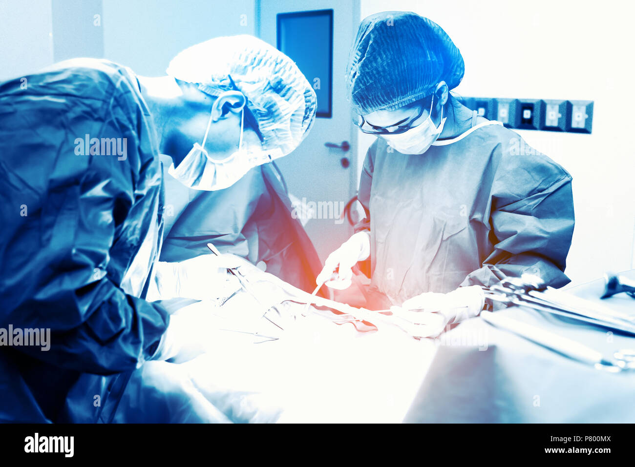 Doctor and assistant nurse operating for rescue patient from dangerous ...