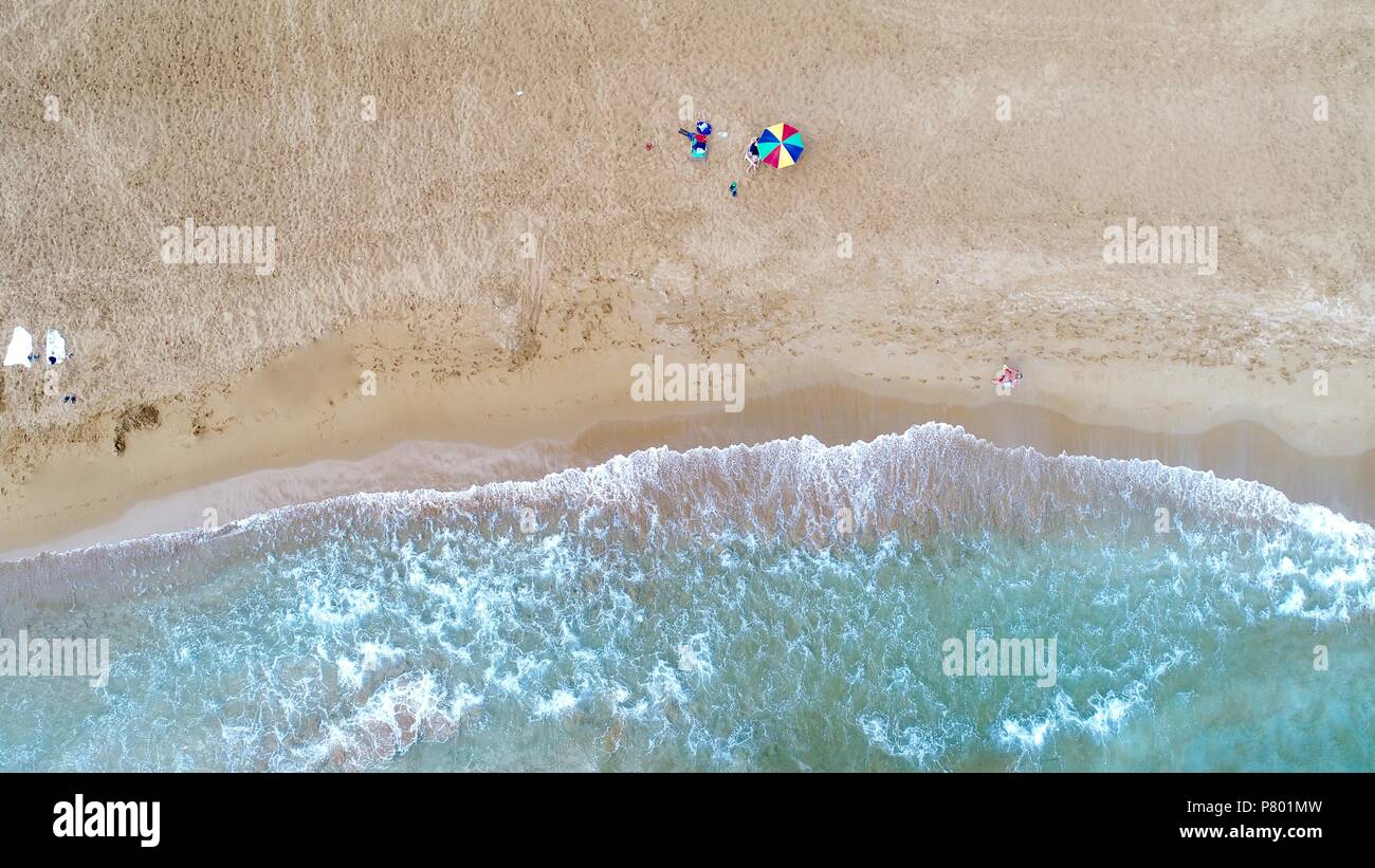 Aerial view of alone colorful umbrella on the beach. Holiday concept ...