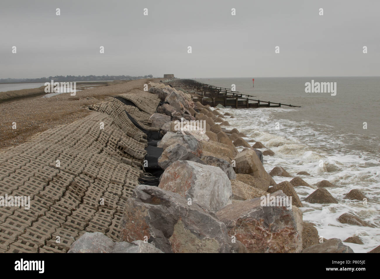 The sea defences and coastal erosion on the spit separating the River ...