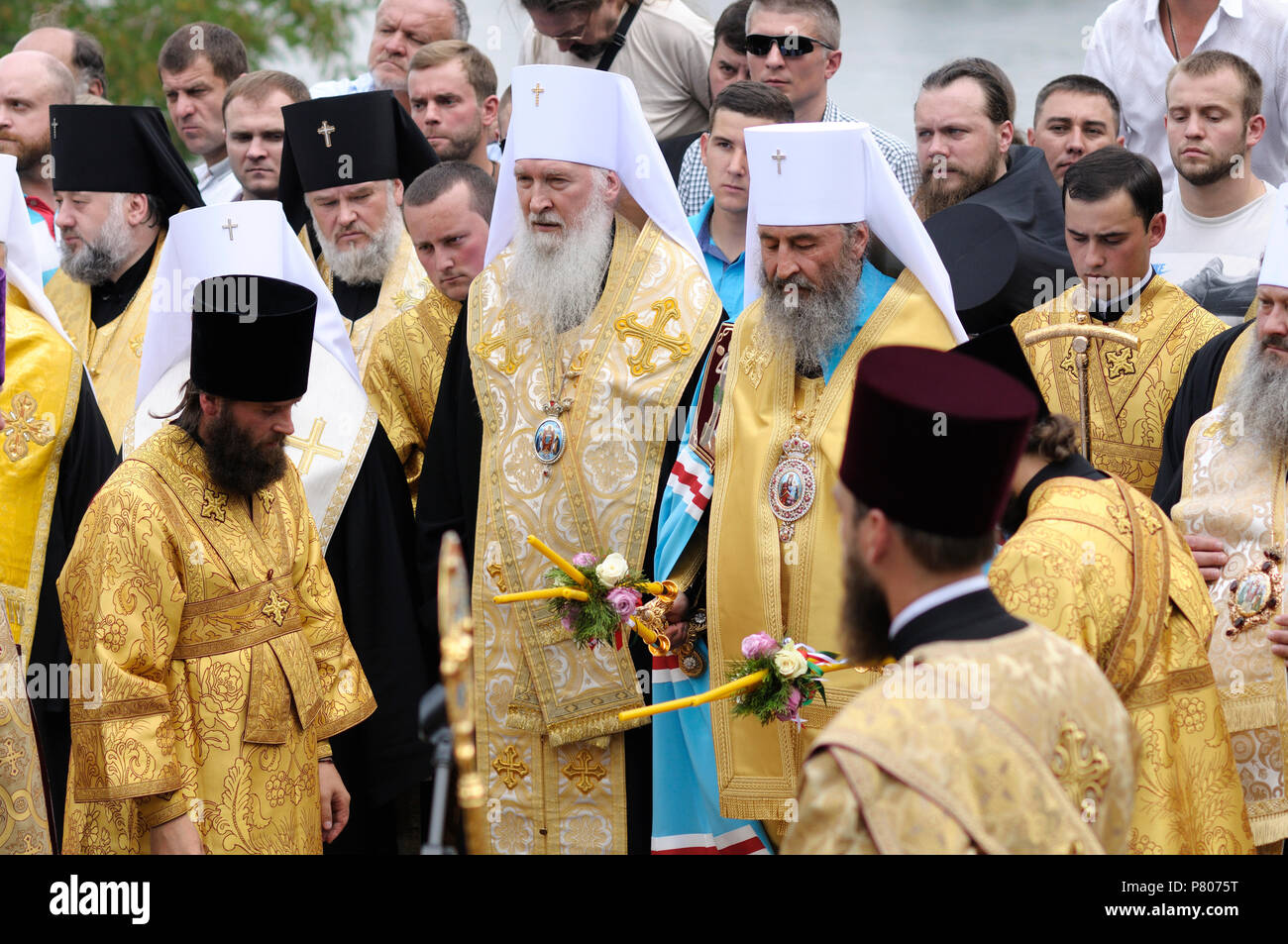 Metropolitan Onufriy (Berezovsky) blessing churchman, priests standing ...