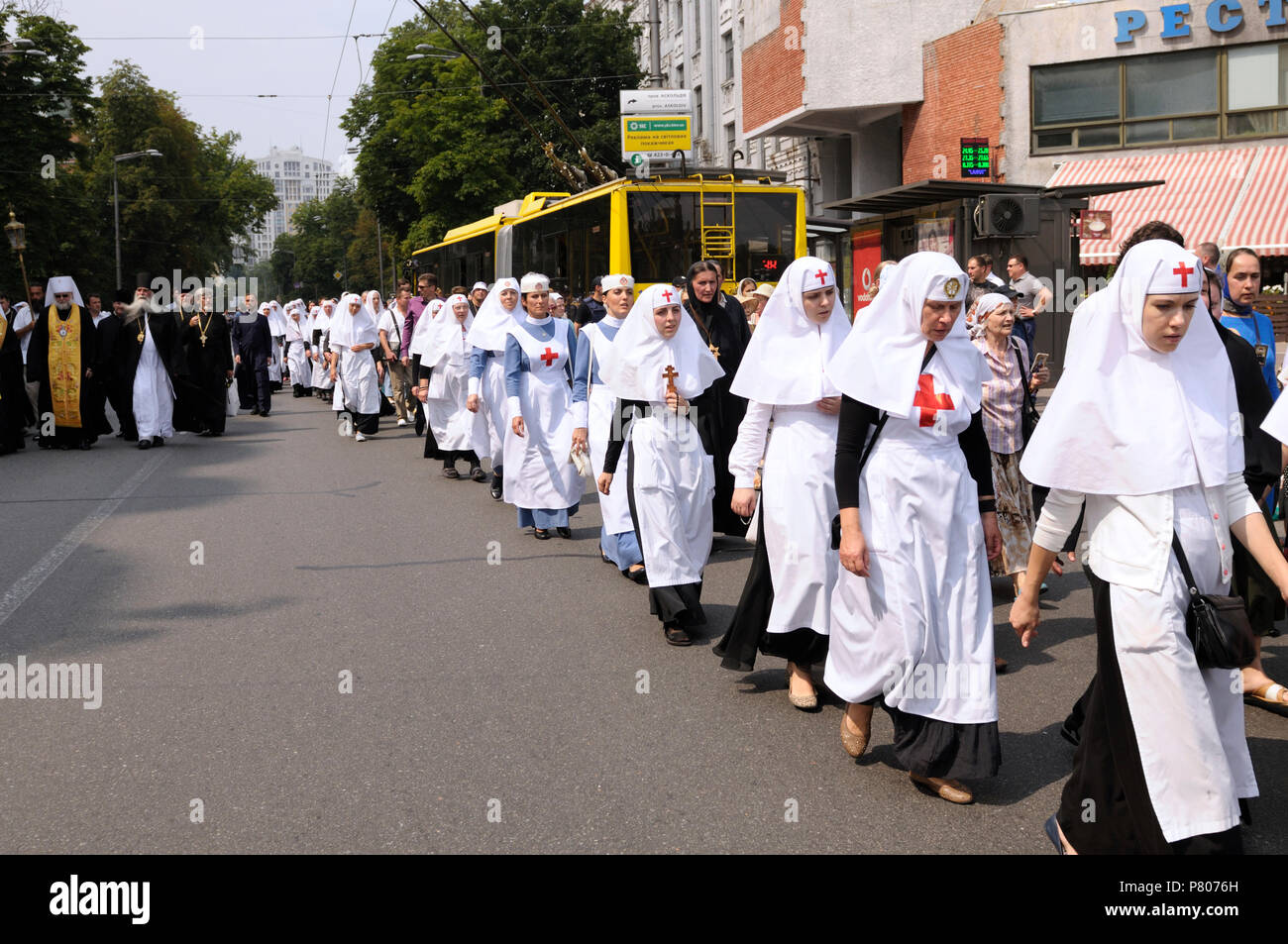Orthodox sisters of charity dressed in white cassocks with red cross ...