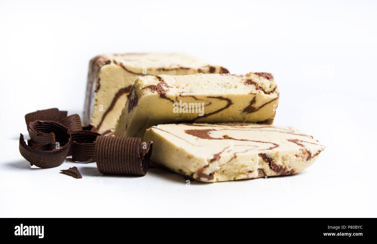 Halva with cacao pieces on white background Stock Photo - Alamy
