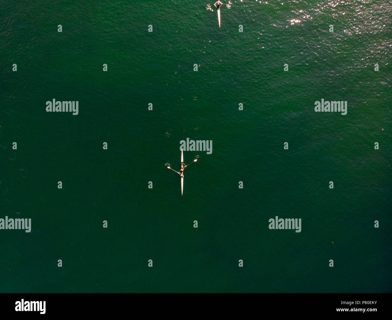 Aerial Drone View of Rowing Team with Canoe in Tranquil Sea / Birds Eye ...