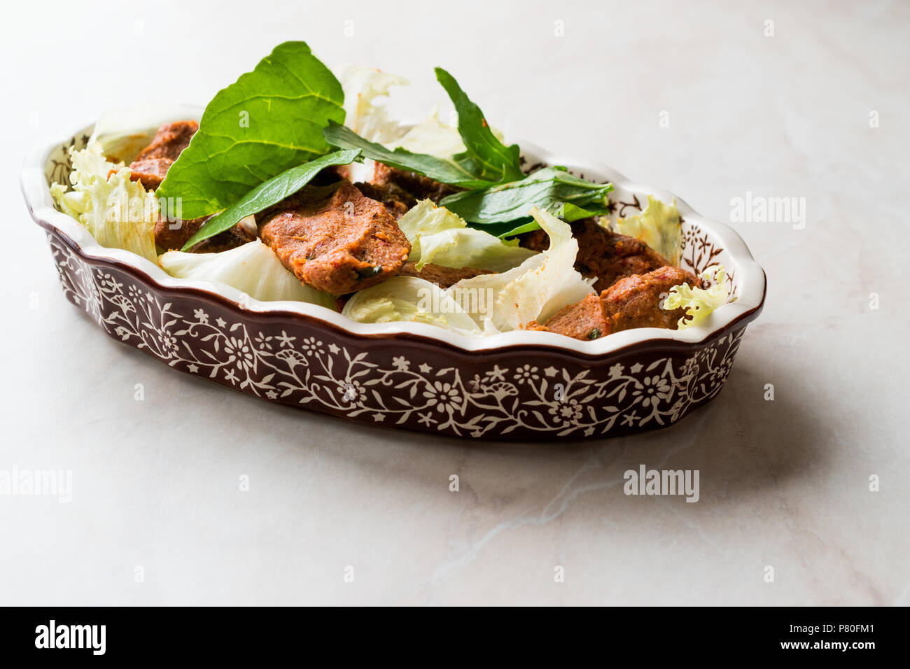 Turkish Food Cig Kofte with lettuce and Rocket Leaves or Arugula ...