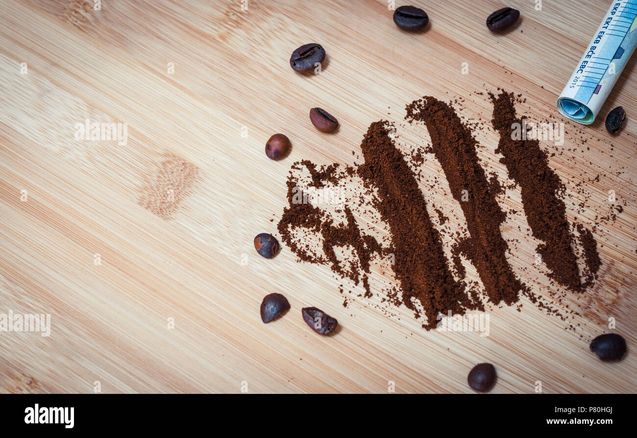 Coffee addiction concept image with coffee beans, ground coffee and a ...
