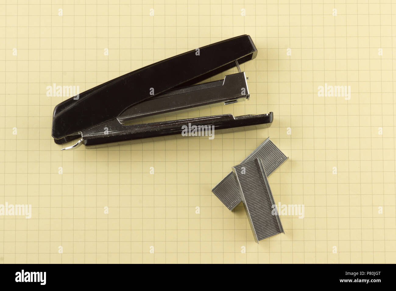 black stapler with paper clips shot close-up Stock Photo - Alamy