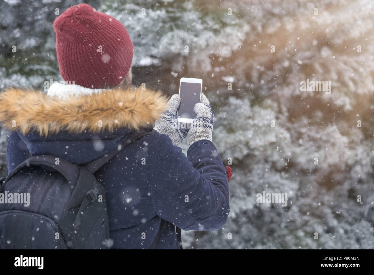 Rear view man holding smartphone hi-res stock photography and images ...