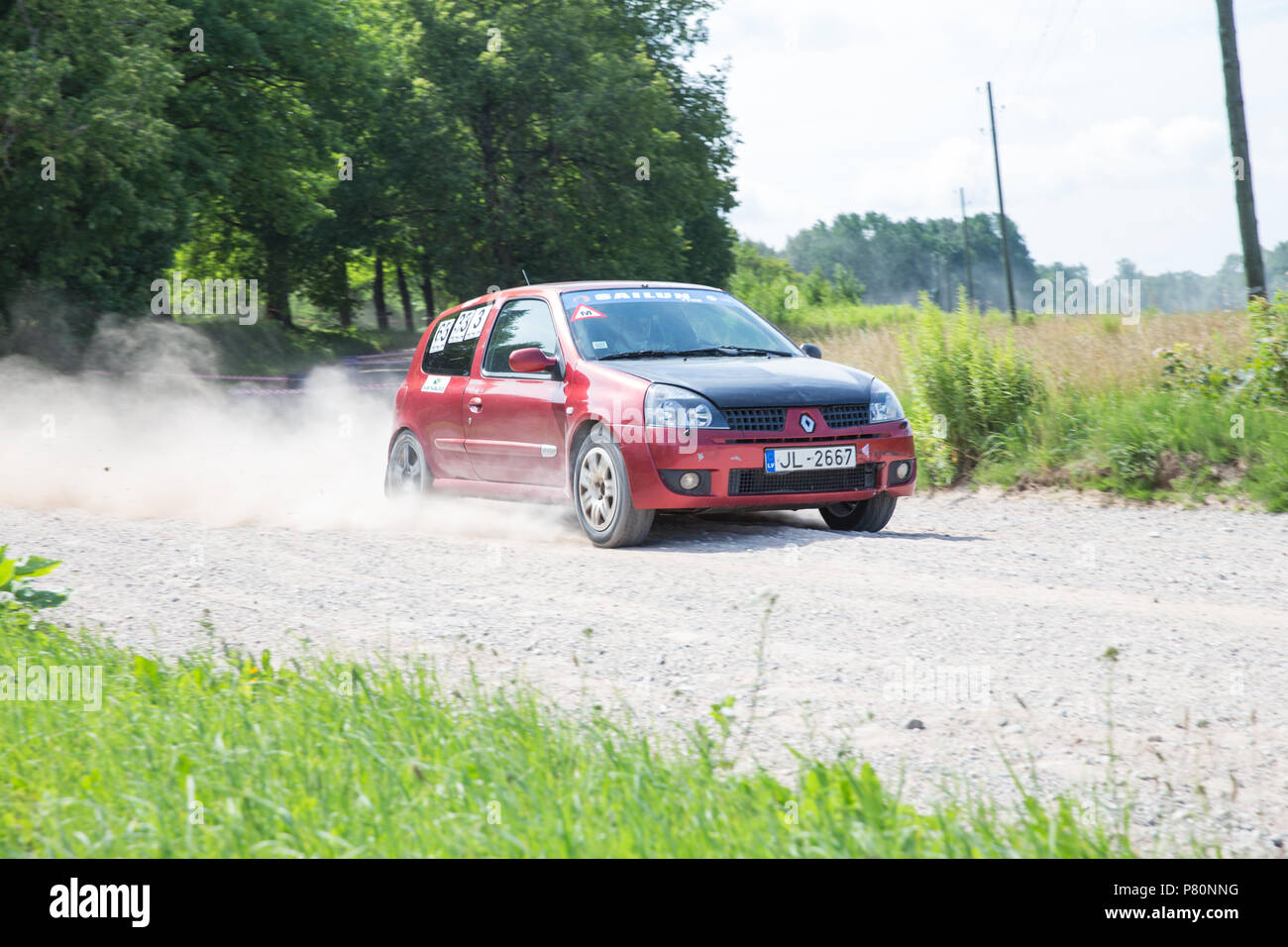City Livi, Latvia. Amateur rally, dirt road, car with rider. Speed and ...