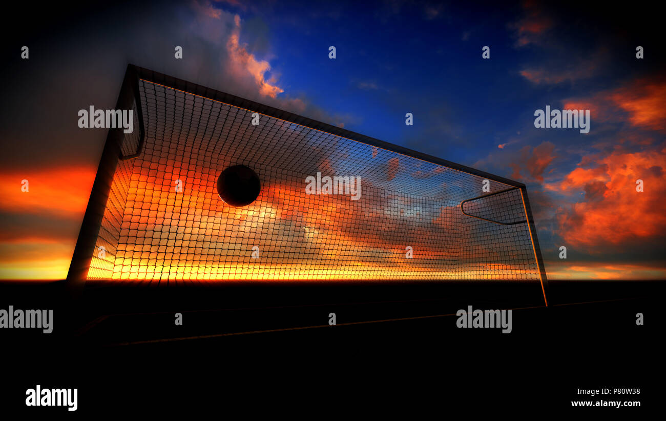 Soccer ball was floated into the goal on the football field at sunset ...