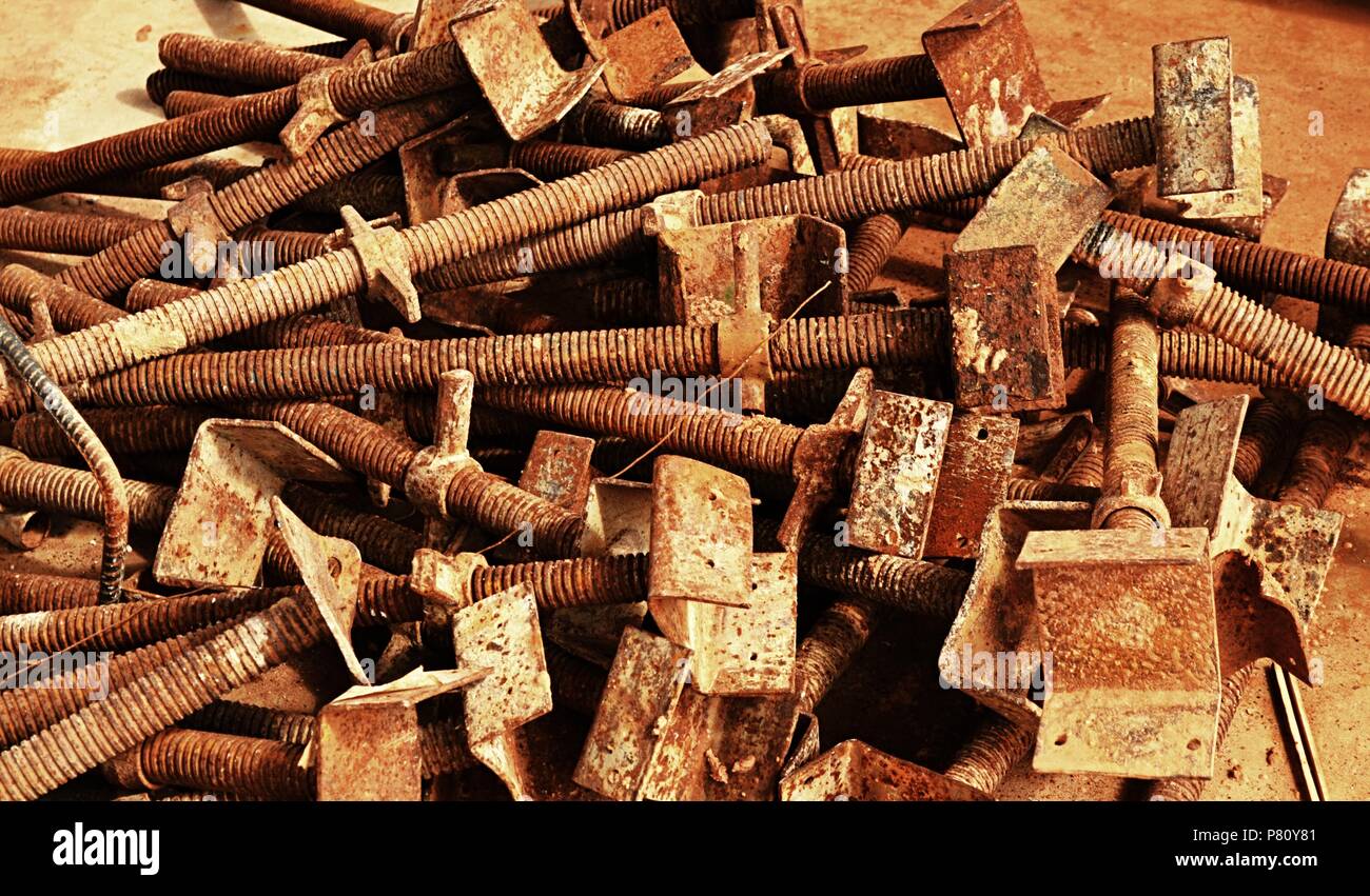 Rusty scrap metal on the ground Stock Photo - Alamy