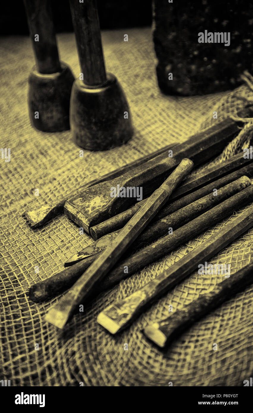 Old tools for carving stone of handmade way, detail of old manual craft ...