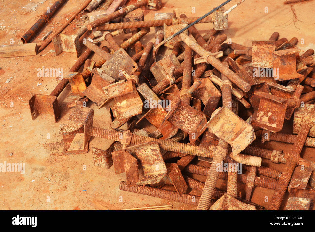 Rusty scrap metal on the ground Stock Photo - Alamy