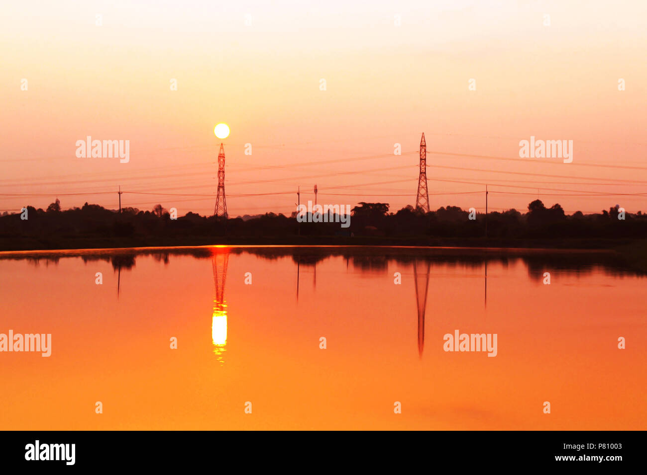 telephone poles on sunset at the river Stock Photo - Alamy