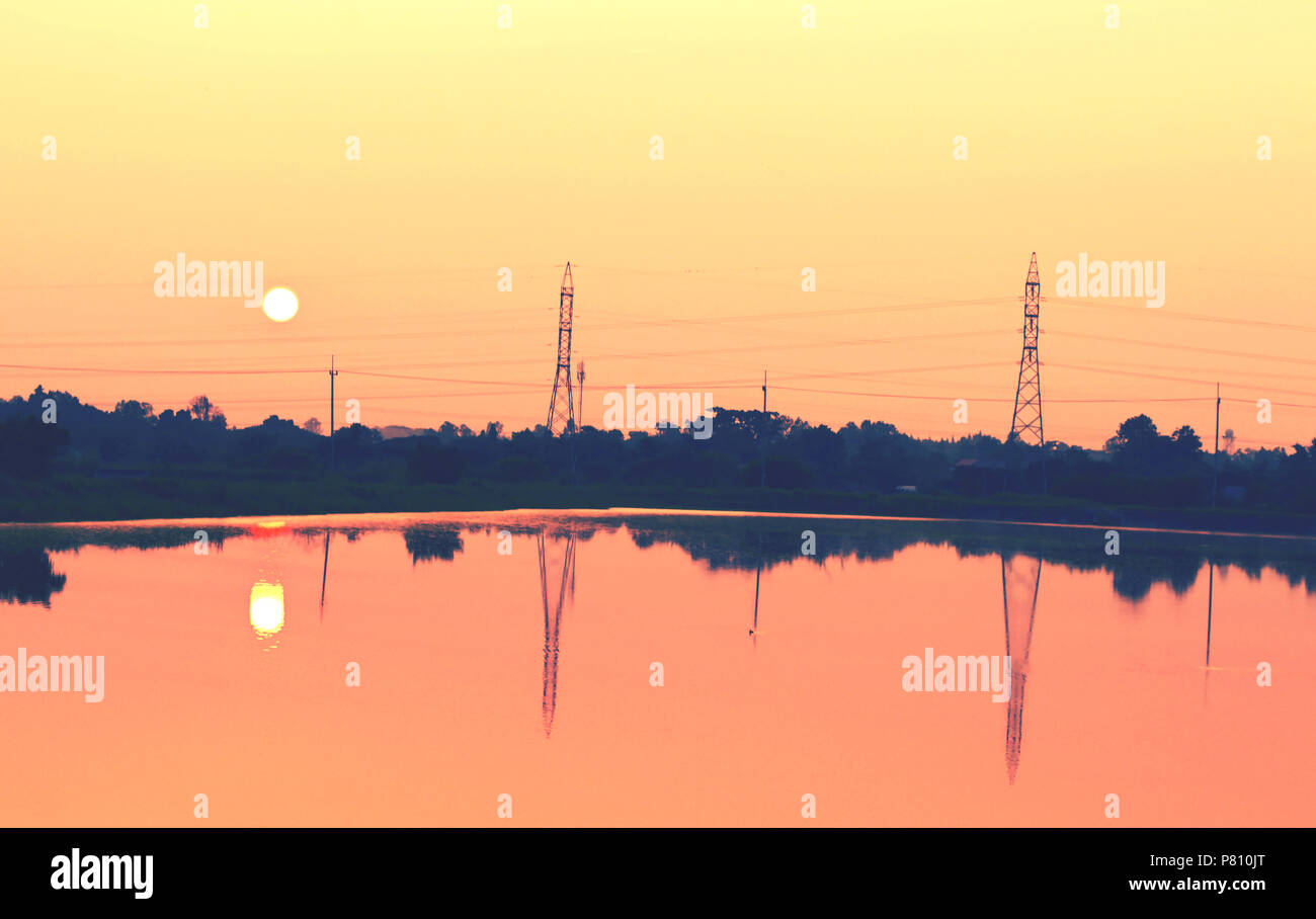 telephone poles on sunset at the river Stock Photo - Alamy