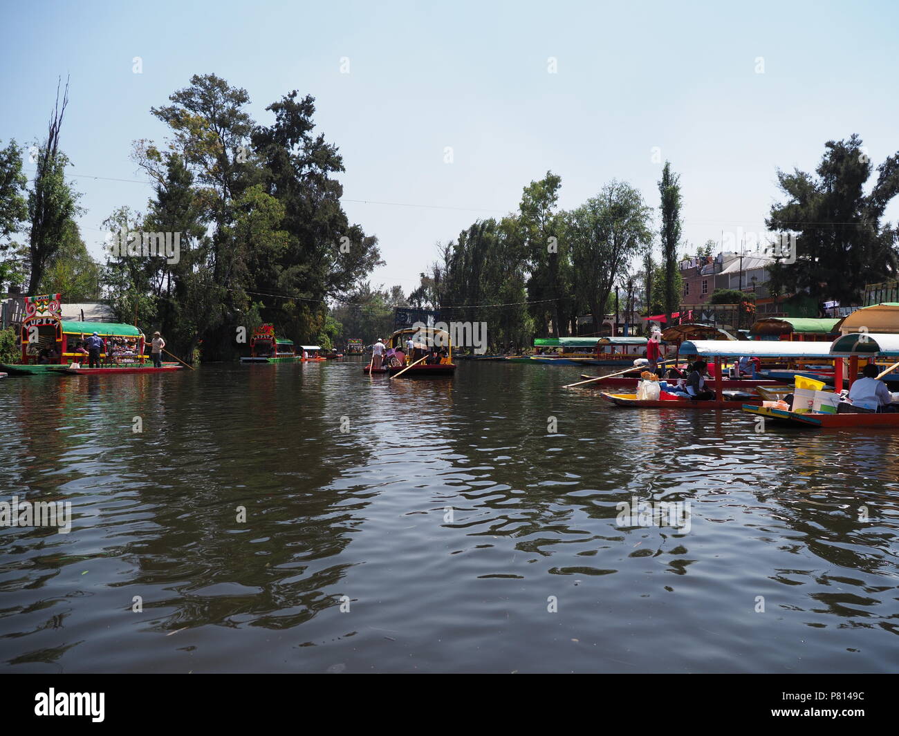 XOCHIMILCO, MEXICO on MARCH 2018: Several colored boats with tourists ...
