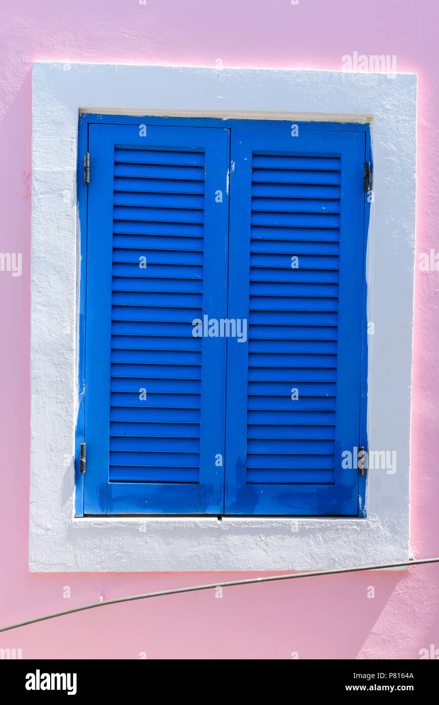Rustic traditional blue window shutters Stock Photo - Alamy