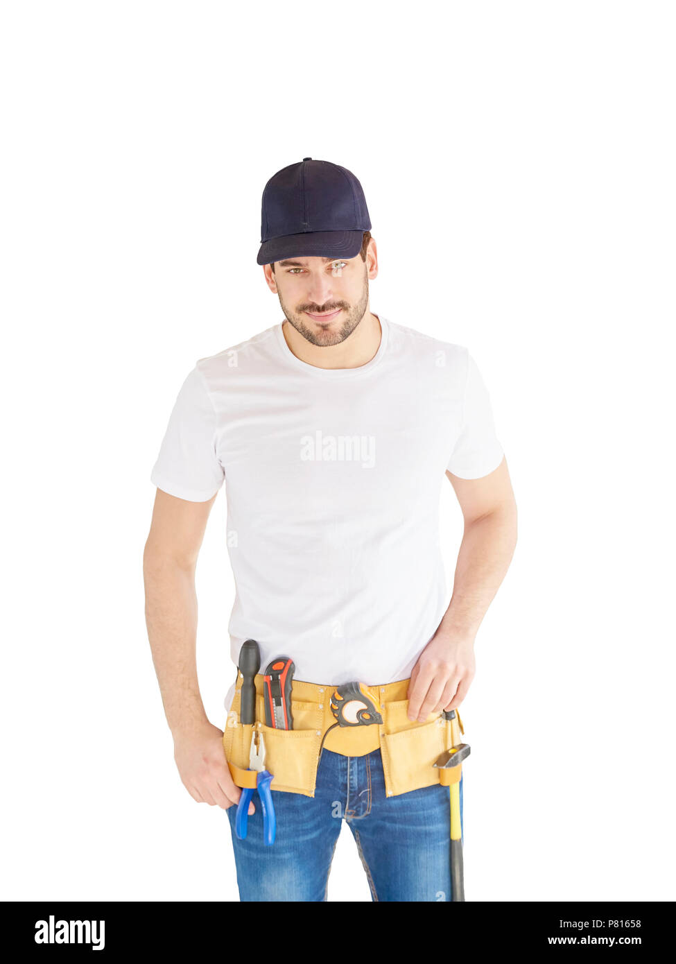Portrait of handsome young handyman wearing baseball cap and tool belt ...