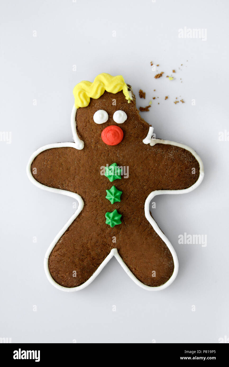Close up top view of screaming eaten gingerbread man with crumbs ...