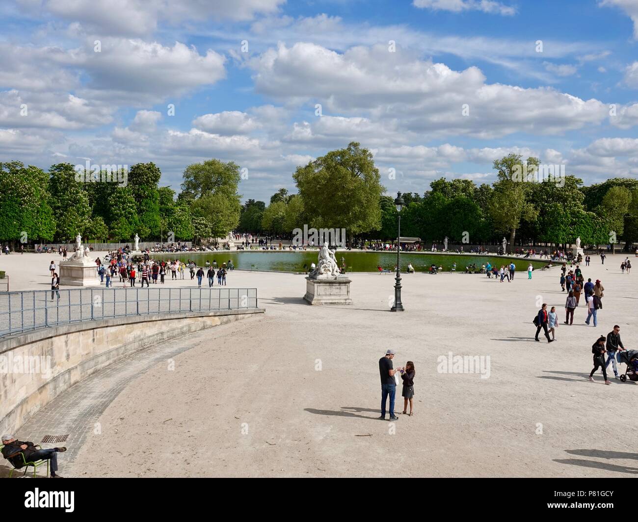 Crowds of people enjoying the warm April weather and relaxing around ...