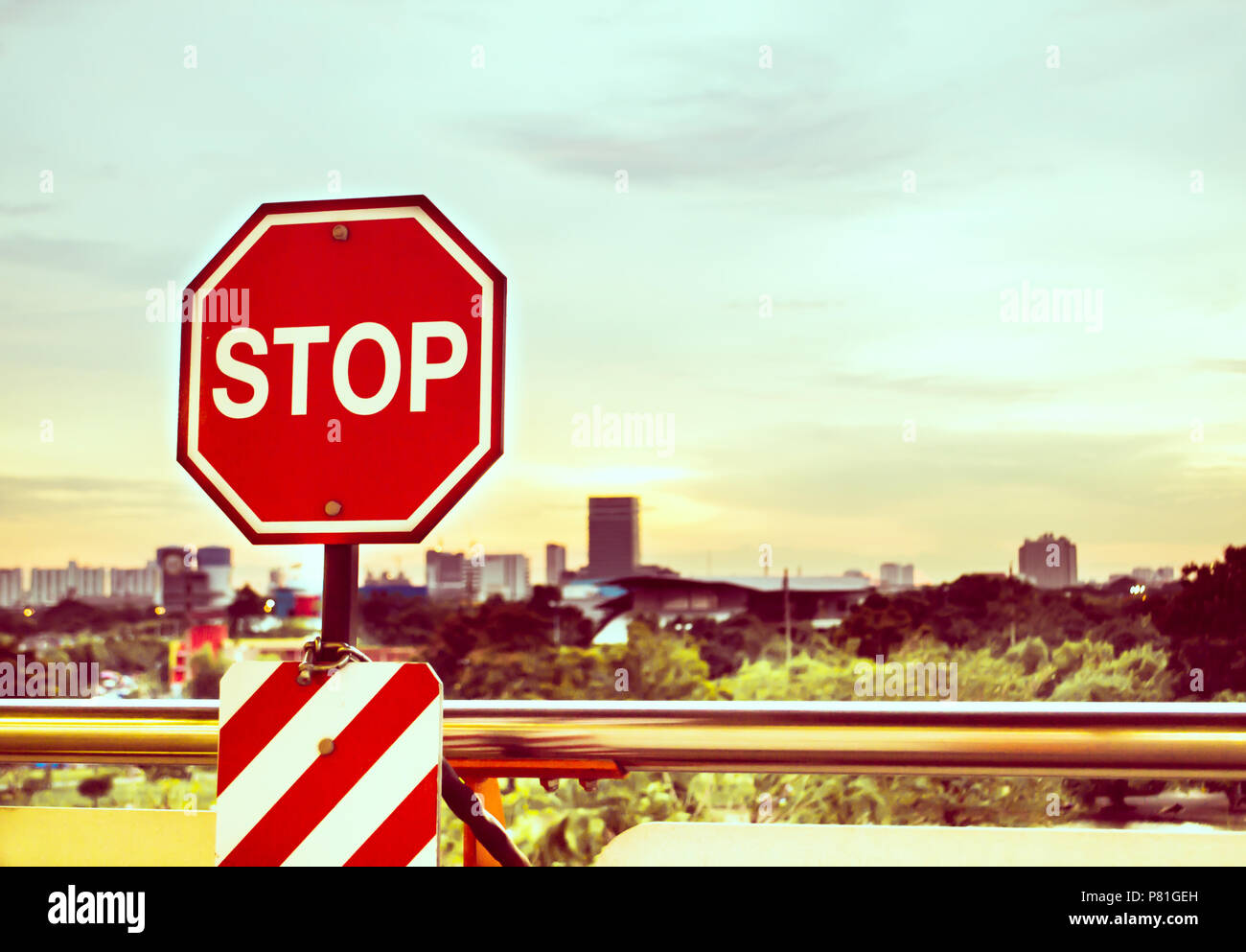 Stop sign in a black and white image with City Landscape Stock Photo ...