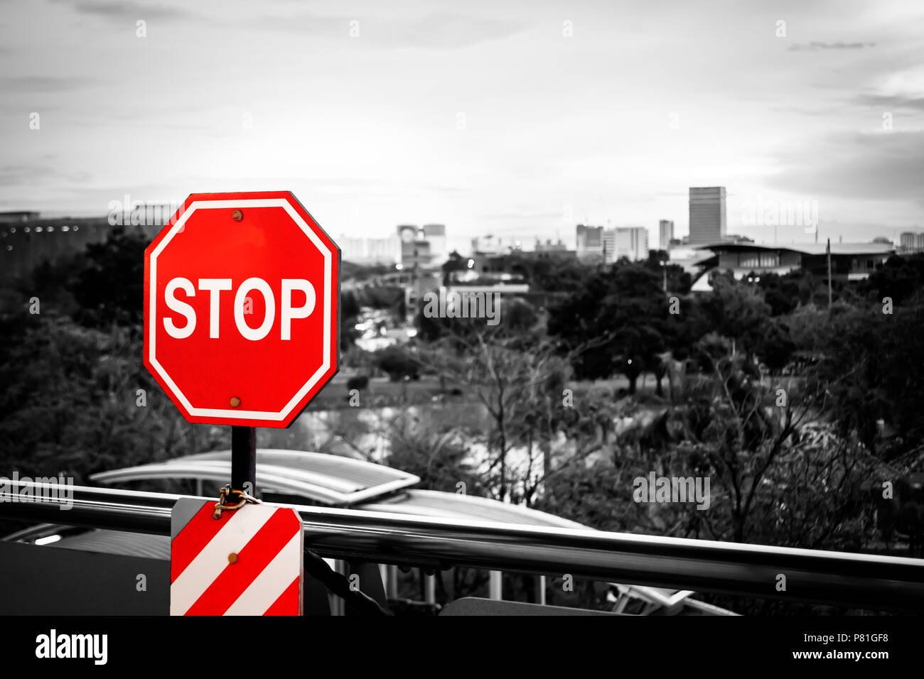 Stop sign in a black and white image with City Landscape Stock Photo ...