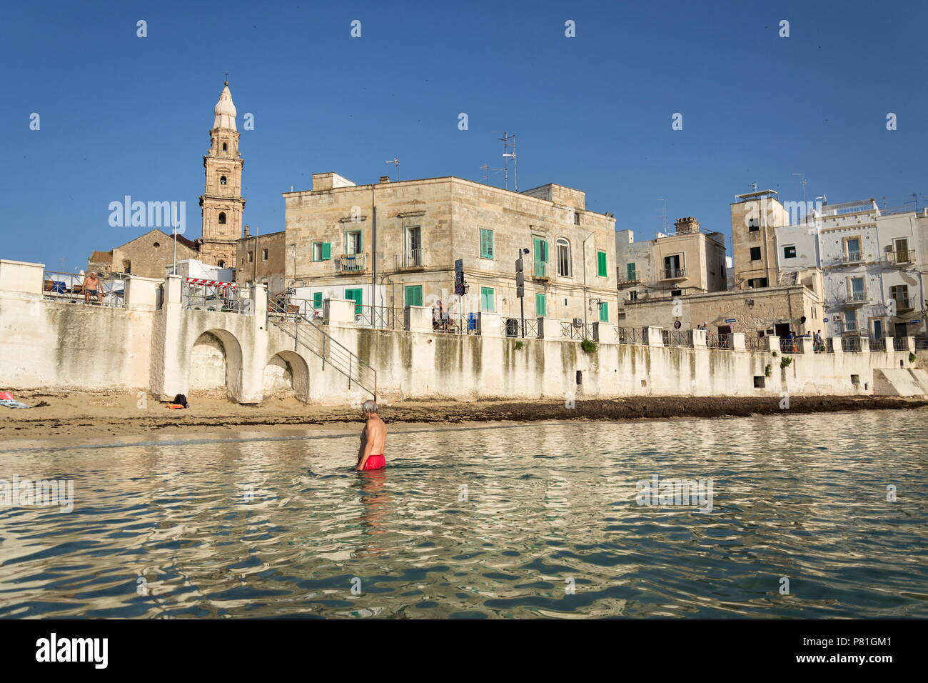 MONOPOLI, ITALY - JULY 2 2018: People swimming on beach Porta Vecchia ...