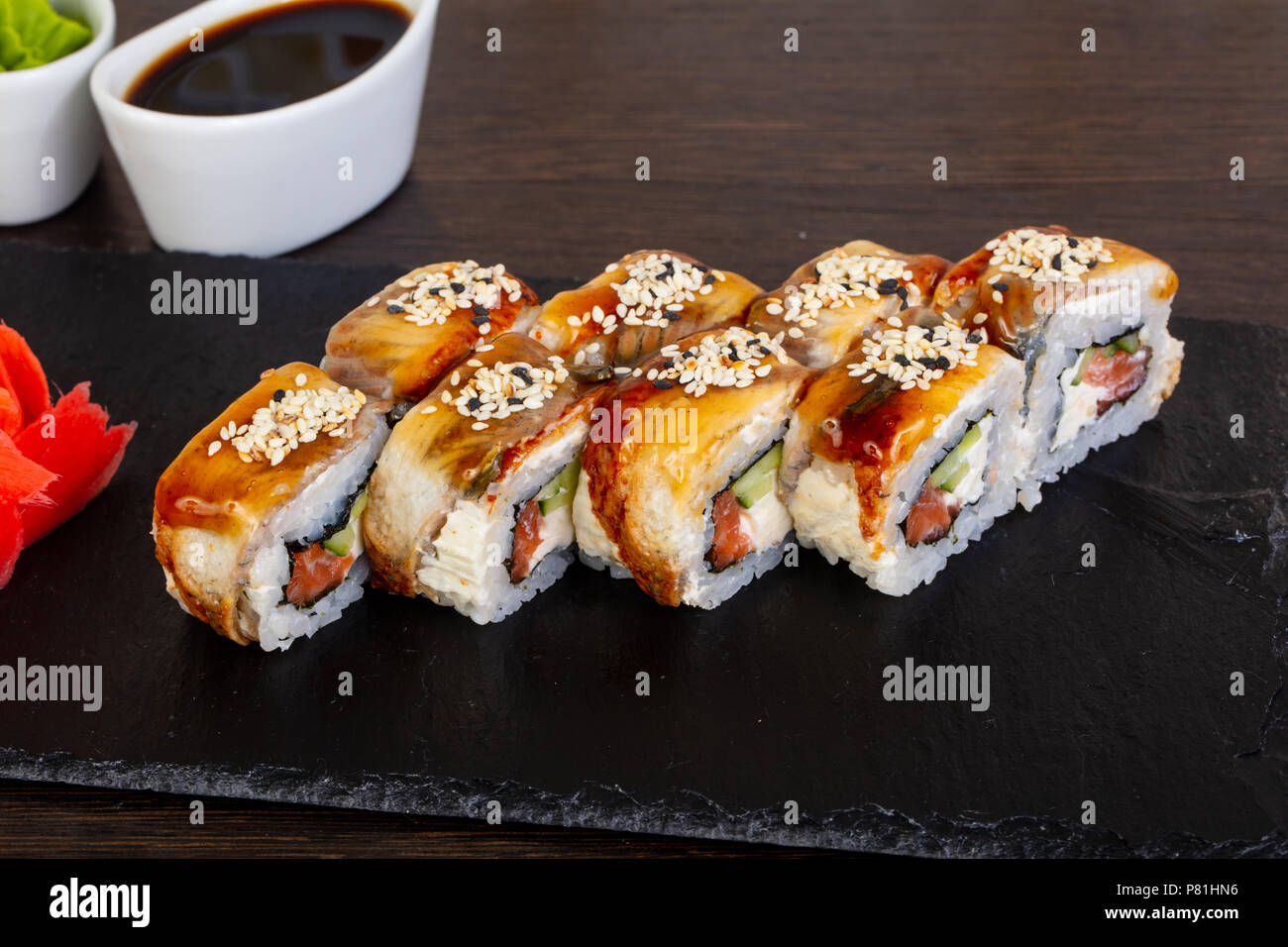 Tasty eel sushi with sesame and teriyaki Stock Photo - Alamy