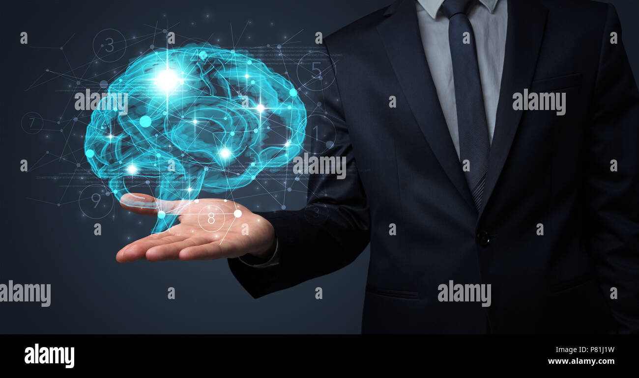 Businessman holding human brain on his hand with logistics symbols ...