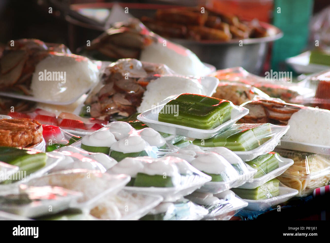 Different kinds of Lao desserts sold on the street market of Vientiane ...