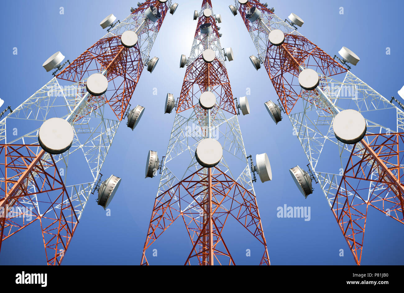 Bottom View of Telecommunication tower under blue sky Stock Photo - Alamy