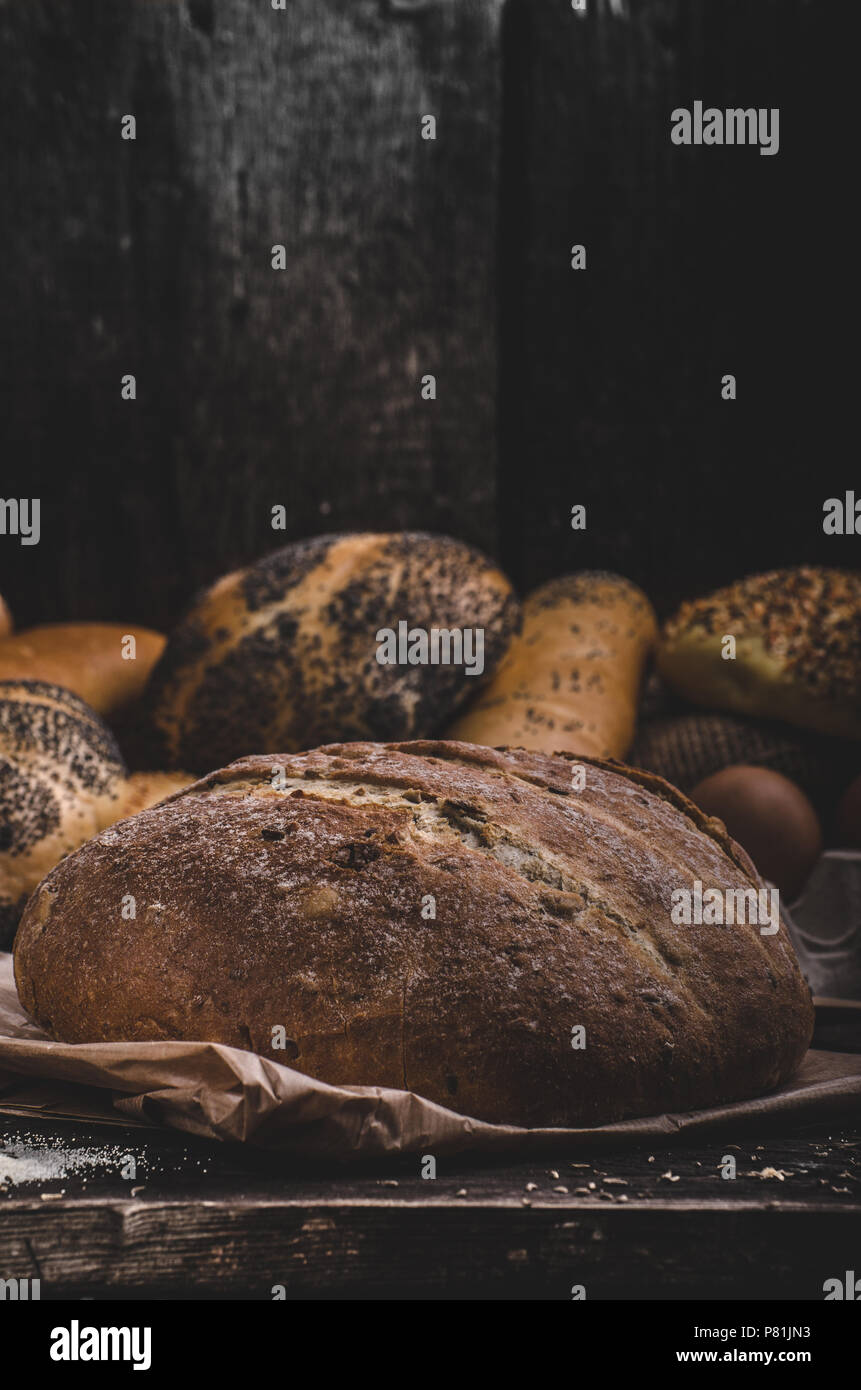Homemade bread, product photo, selective focus, others pastries behind ...