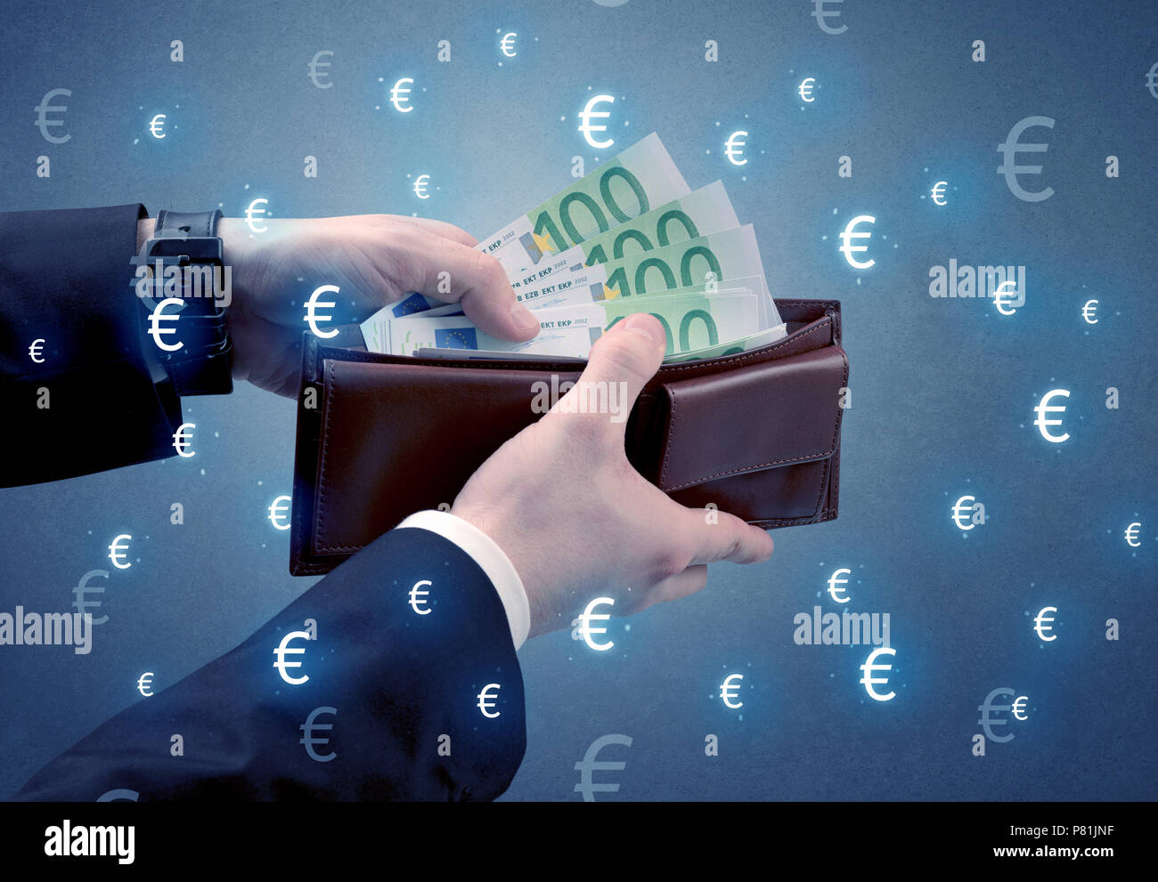 Businessman's hand takes out euro from a wallet with euro symbol ...