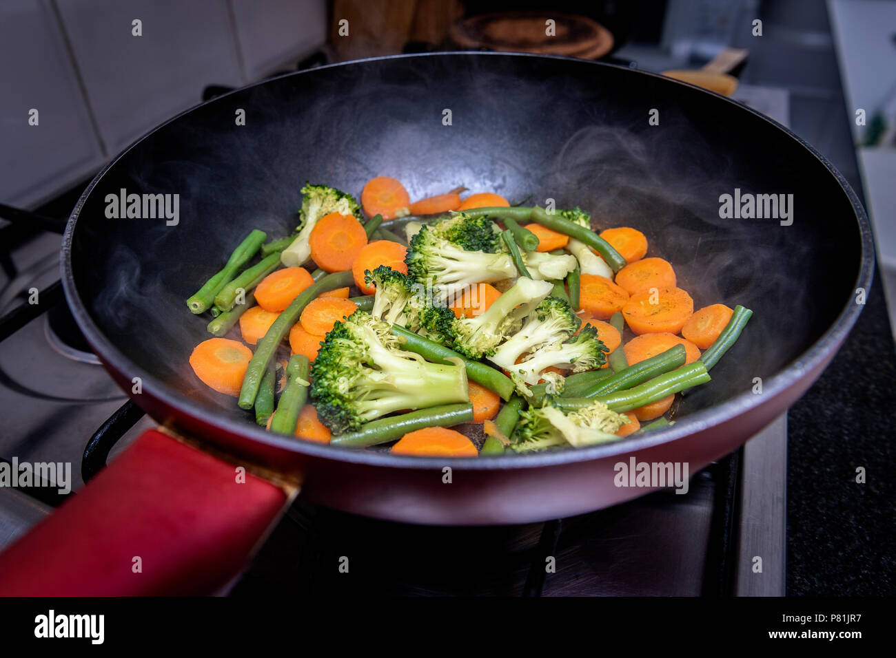 Food cooking in pan steam hi-res stock photography and images - Alamy