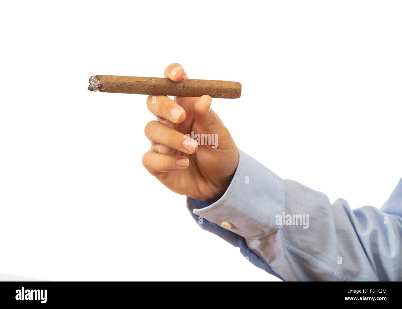 Smoking. Cuban cigar in a male hand isolated on white background ...