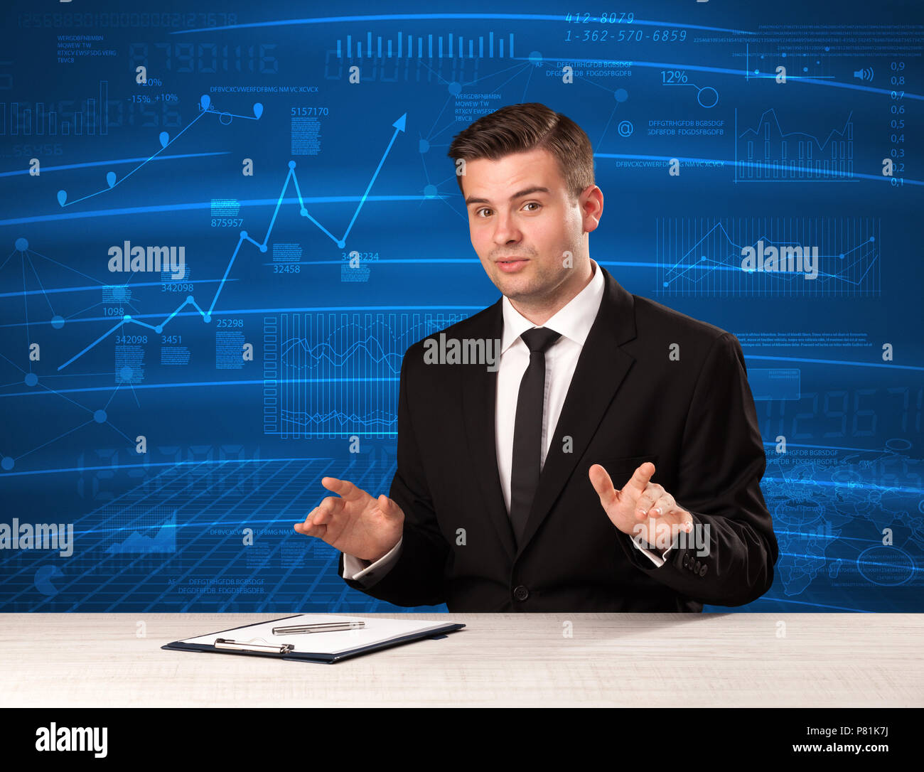 Stock data analyst in studio giving adivce on blue chart background ...