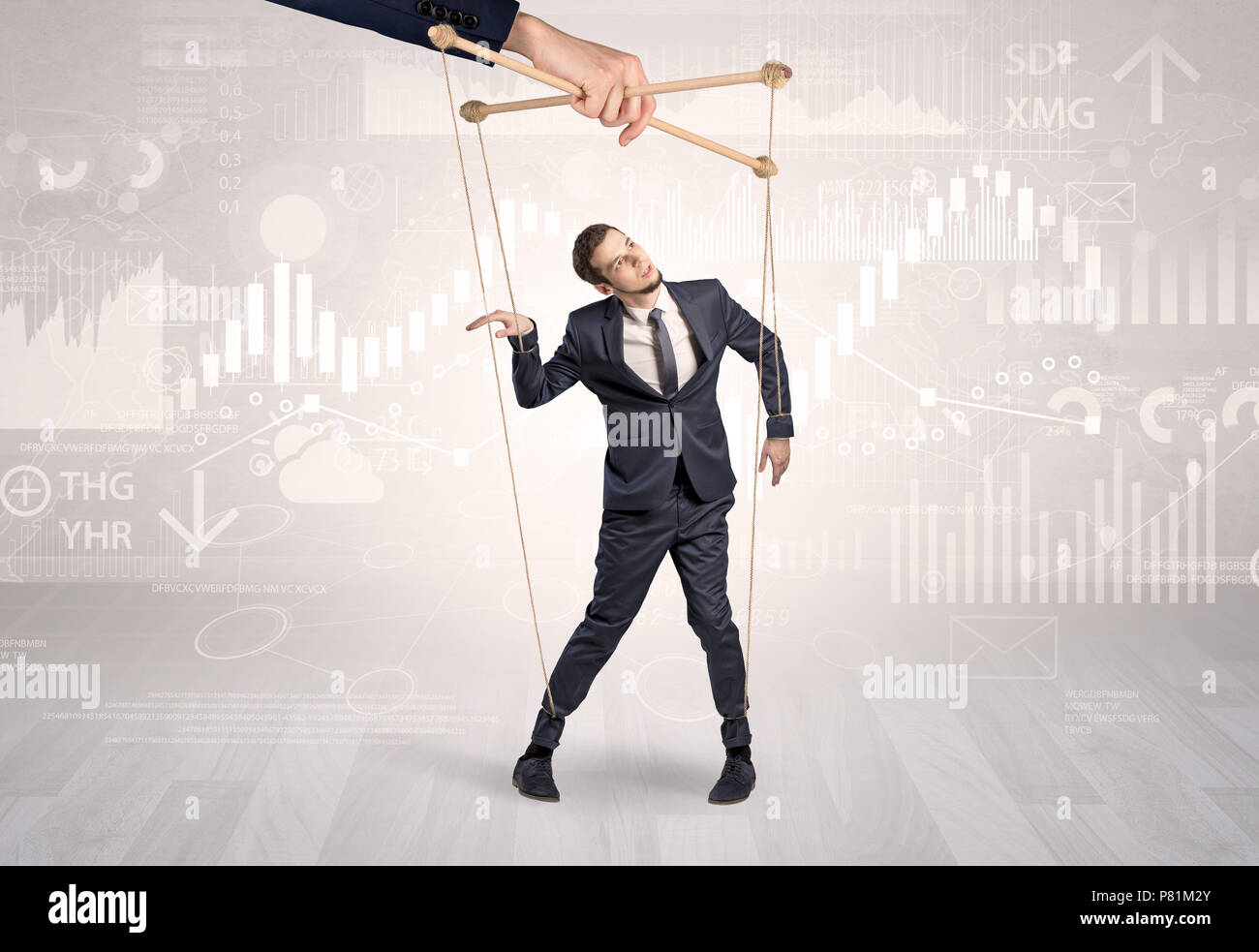 Puppet businessman controlled by another hand with financial concept ...