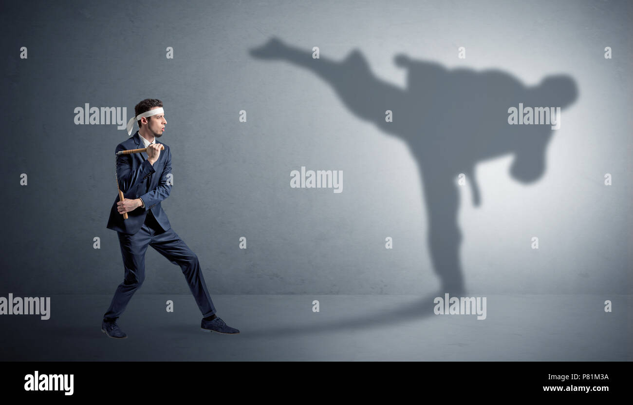 Young karate man confronting with his own shadow Stock Photo - Alamy