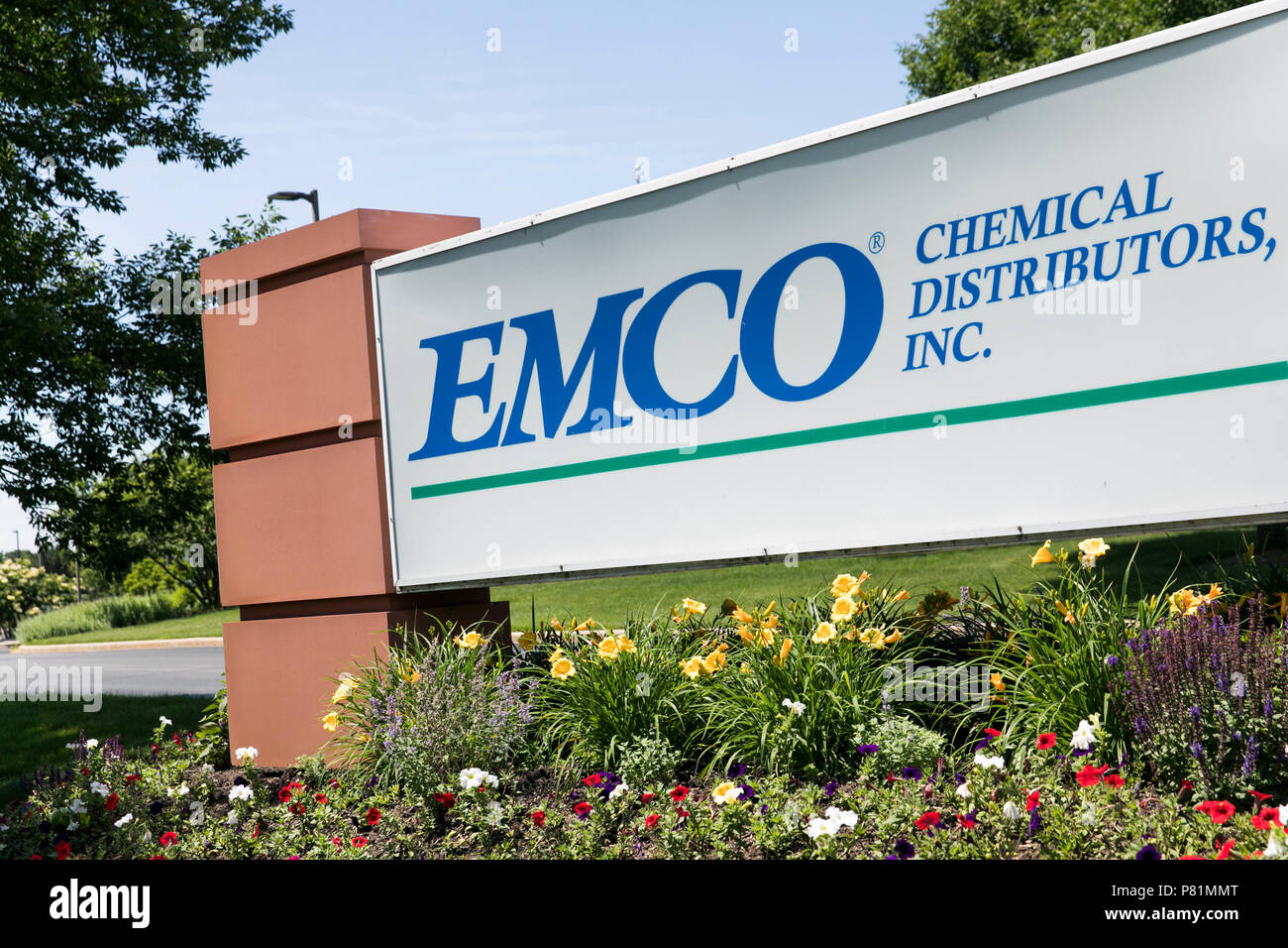 A logo sign outside of the headquarters of EMCO Chemical Distributors ...