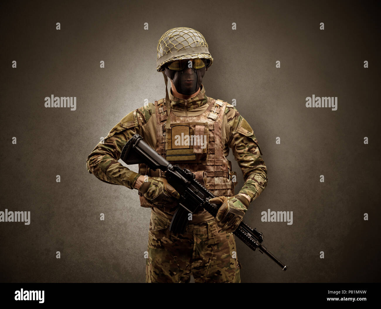 Soldier agent in a dark room with arms on his hand and gas mask Stock ...