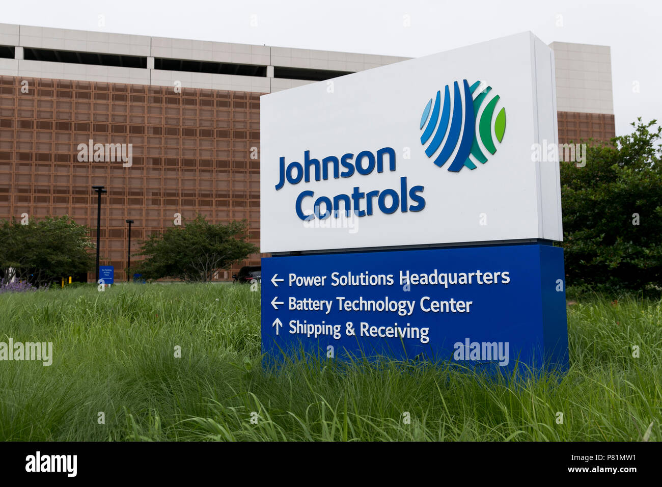 A logo sign outside of the headquarters of Johnson Controls in ...