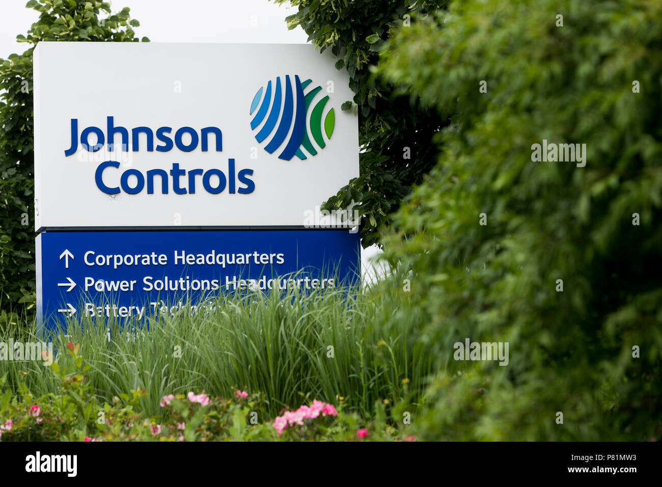 A logo sign outside of the headquarters of Johnson Controls in ...