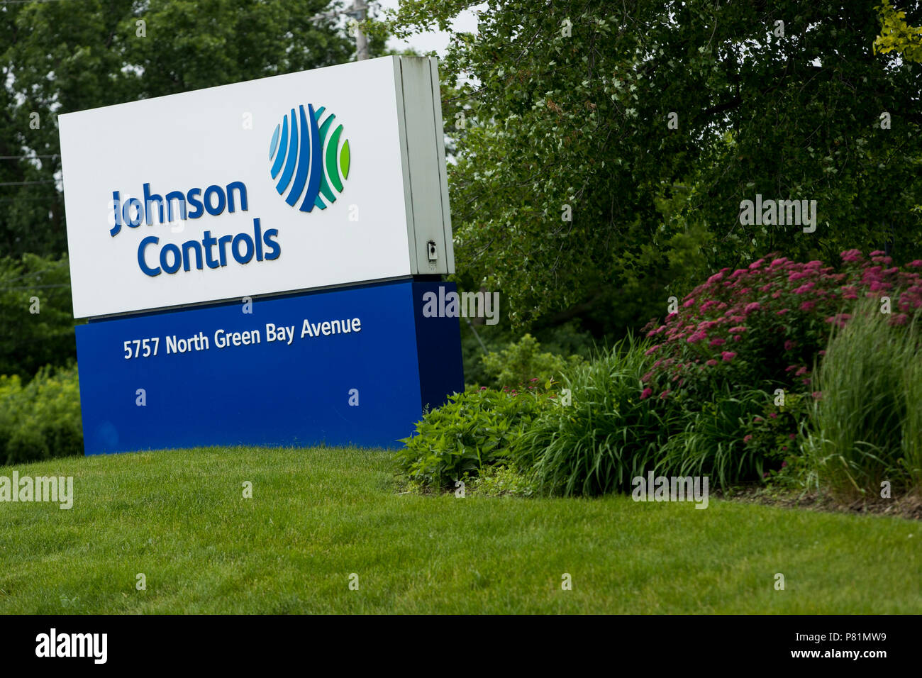 A logo sign outside of the headquarters of Johnson Controls in ...