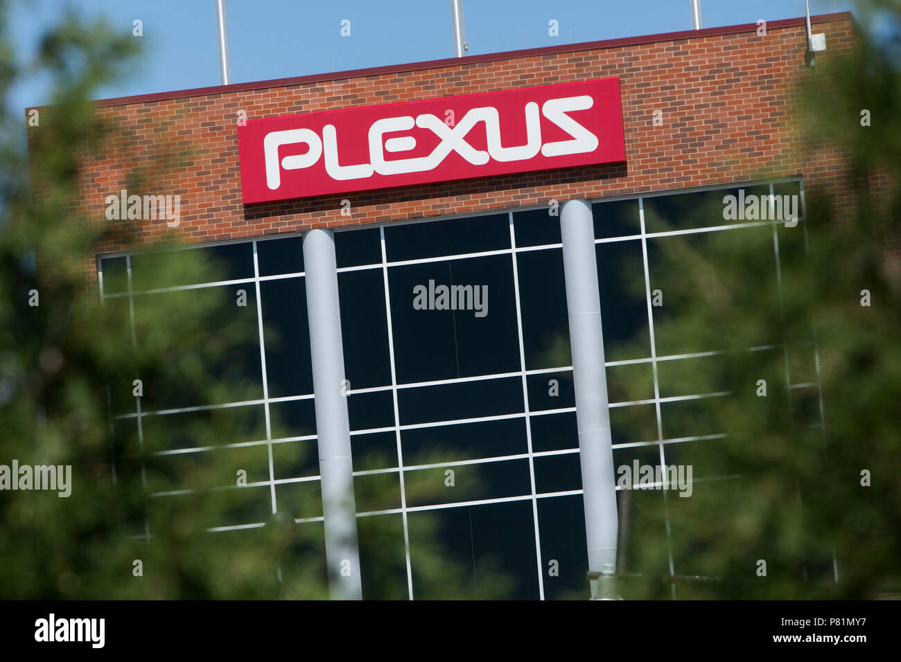 A logo sign outside of a the headquarters of Plexus Corp., in Neenah ...