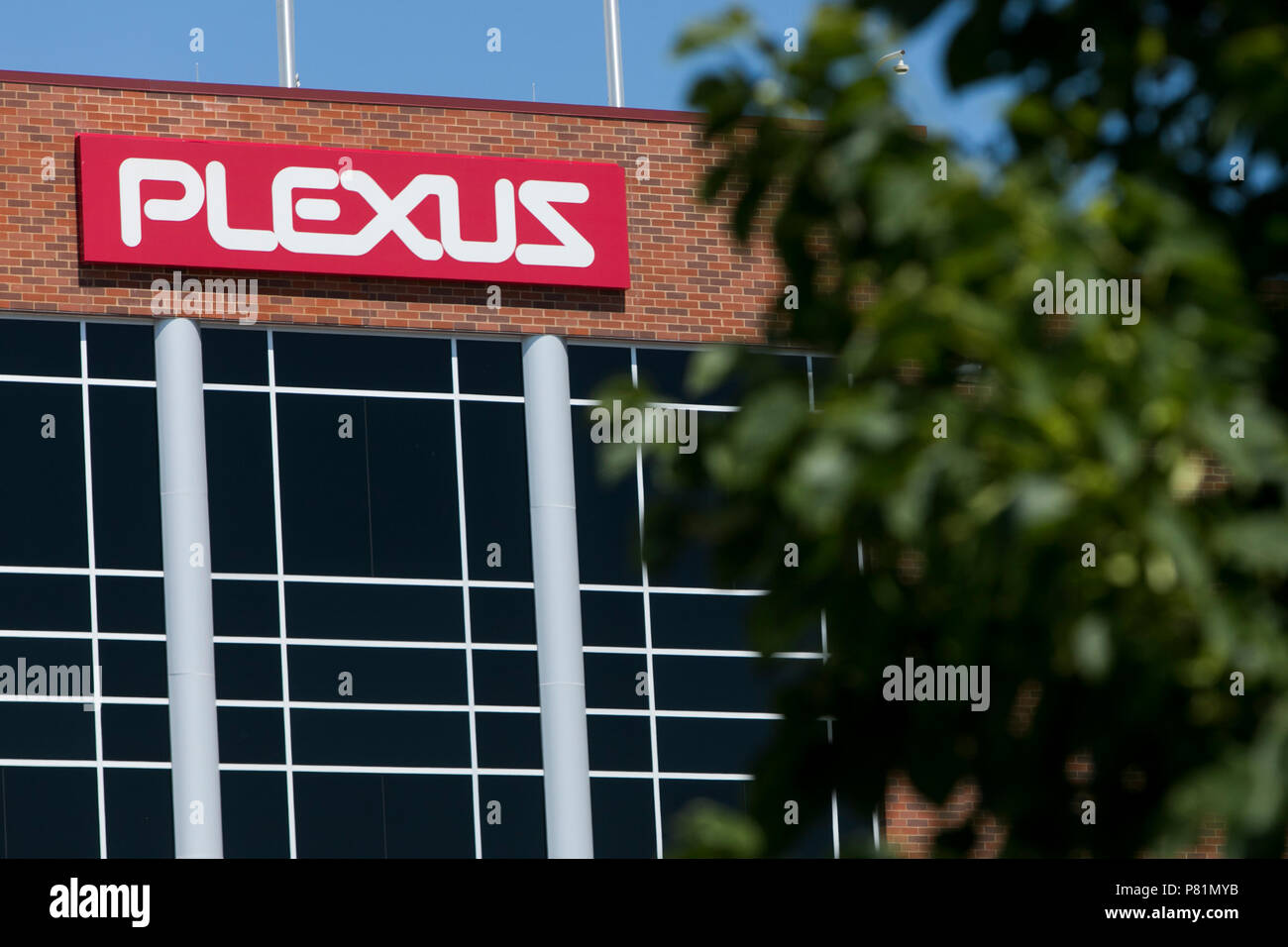 A logo sign outside of a the headquarters of Plexus Corp., in Neenah ...