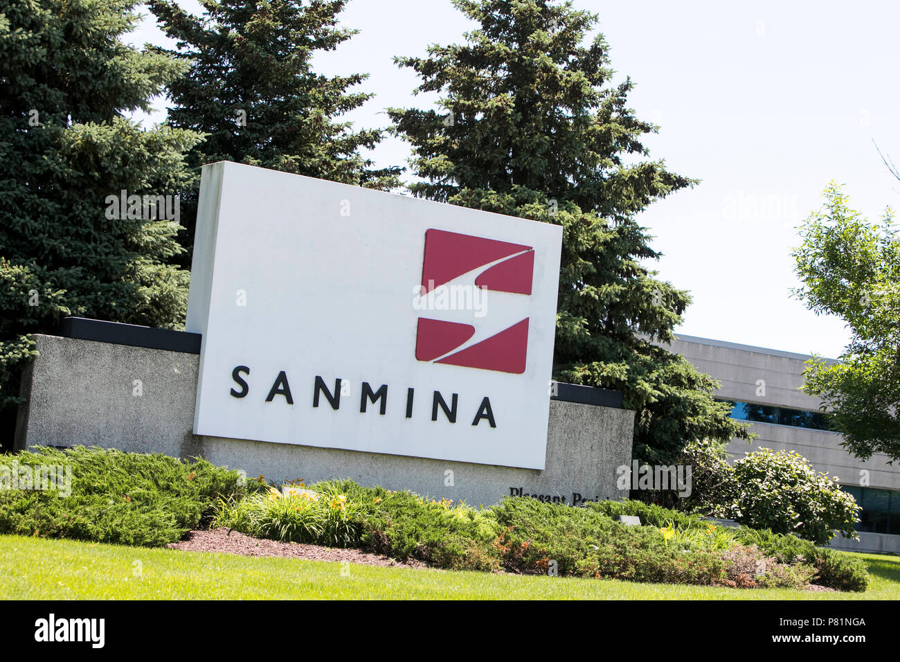 A logo sign outside of a facility occupied by the Sanmina Corporation ...