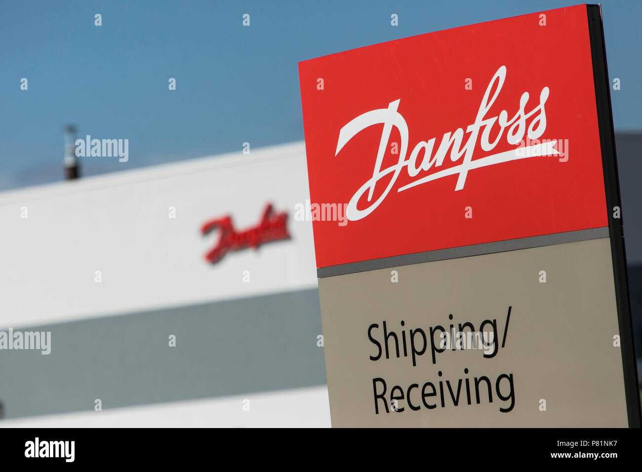 A logo sign outside of a facility occupied by The Danfoss Group in ...